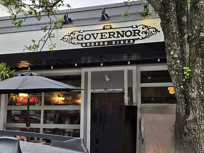 The Governor's elegant storefront beckons from Milford's Main Street, promising modern diner magic behind its unassuming facade.