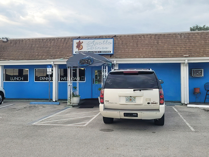 The unassuming blue exterior of Apollo Diner stands like a culinary TARDIS – modest on the outside, but containing universes of flavor within.