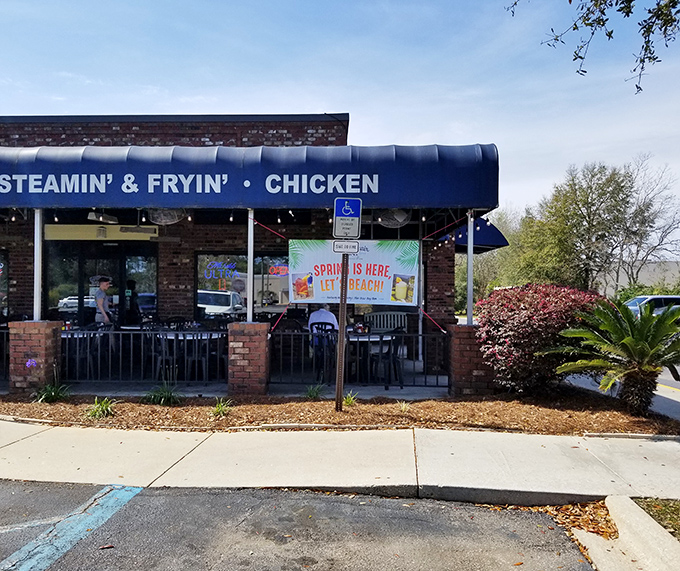 That blue awning isn't just decoration—it's a beacon calling you home to some seriously good Gulf Coast eating.