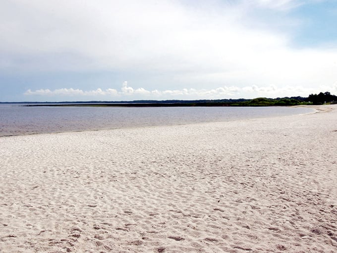 The pristine white sands of East Lake Toho stretch toward the horizon, offering a coastal experience without the coastal crowds. Mother Nature's best-kept Florida secret.