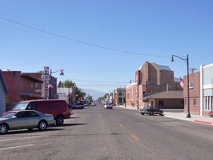 Main Street stretches toward distant mountains, offering that quintessential small-town Idaho vista where time seems to move at its own leisurely pace.