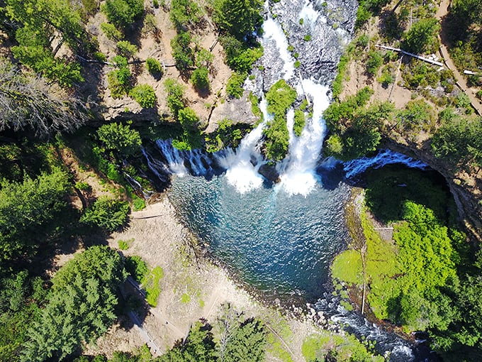 Nature's ultimate flex! An aerial view of Burney Falls showcasing that impossible turquoise pool and the waterfall's dramatic 129-foot cascade.