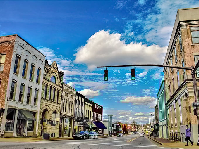 Downtown Madisonville under brilliant blue skies – where historic architecture meets small-town charm and traffic jams involve three cars at most.