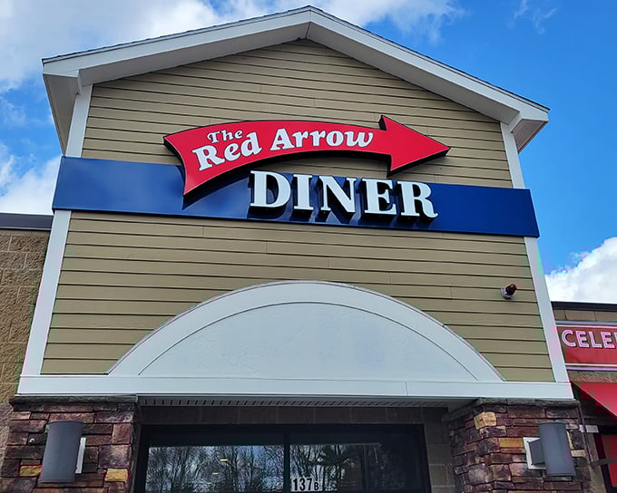 That iconic red arrow sign isn't just pointing to a diner – it's directing you toward breakfast nirvana in Londonderry.