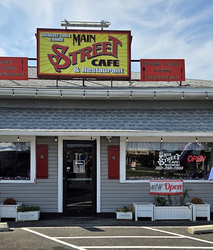 That "NOW OPEN" sign might as well say "COME GET HAPPY" – this unassuming exterior houses Delaware's answer to breakfast nirvana.