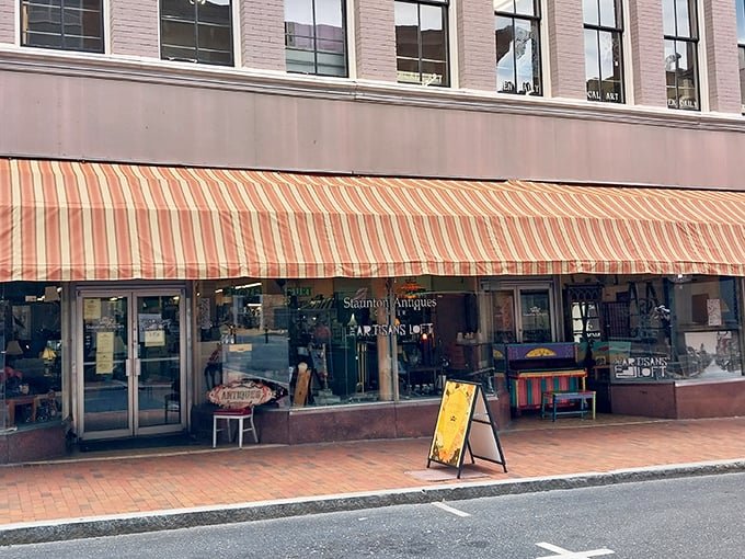 The classic striped awning beckons like a vintage carnival barker: "Step right up, folks! History and treasures await inside!"