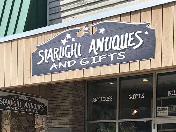 The storefront sign promises "Antiques and Gifts" – like saying Everest is "a pretty tall hill." This weathered beacon has guided treasure hunters for years.