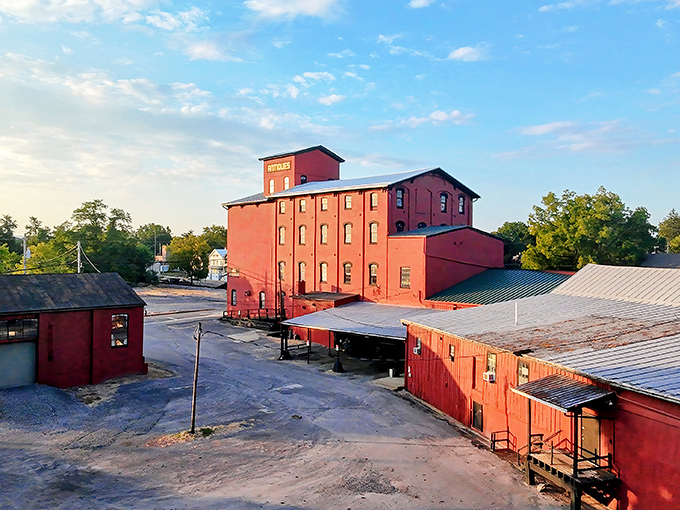 The crimson giant stands proudly against the Pennsylvania sky, a century-old mill transformed into a treasure hunter's paradise. History never looked so inviting.