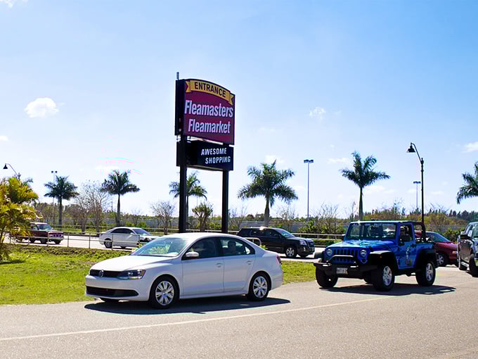 The iconic Fleamasters sign welcomes bargain hunters from across Florida, promising "Awesome Shopping" under perfect blue skies.