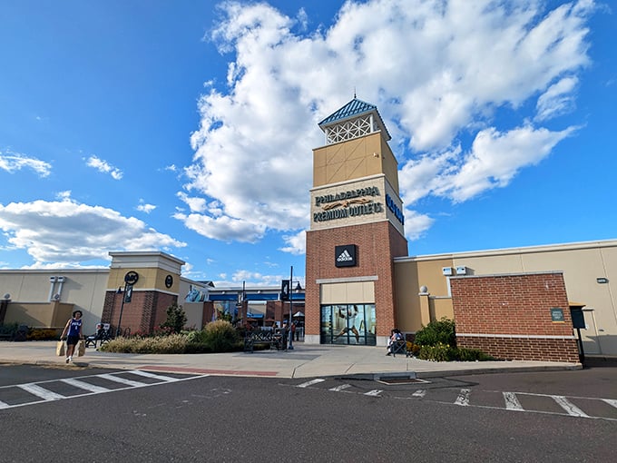 The iconic tower at Philadelphia Premium Outlets stands like a retail lighthouse, guiding bargain hunters to fashion salvation on even the cloudiest Pennsylvania day.