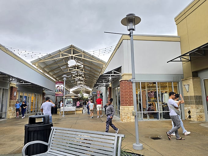 Strolling through the covered walkways feels like a civilized shopping safari – note the strategic bench placement for when your shopping stamina needs a recharge.