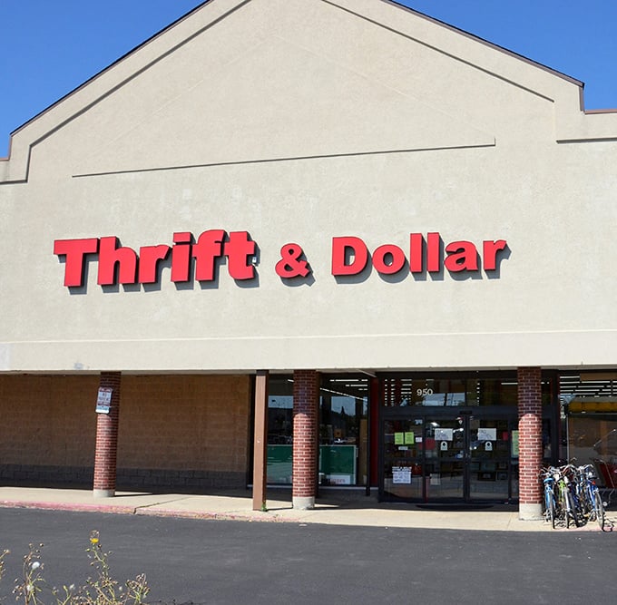 The bold red signage of Thrift & Dollar Inc promises adventure within—like a beacon for bargain hunters navigating the seas of retail markup.