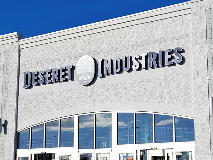 The iconic white facade of Deseret Industries gleams against Utah's blue sky, a beacon for bargain hunters with dreams bigger than their budgets.