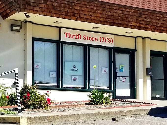 A closer look at Thrift City's storefront with its distinctive cedar-shingled roof. The modest façade keeps the best secrets.