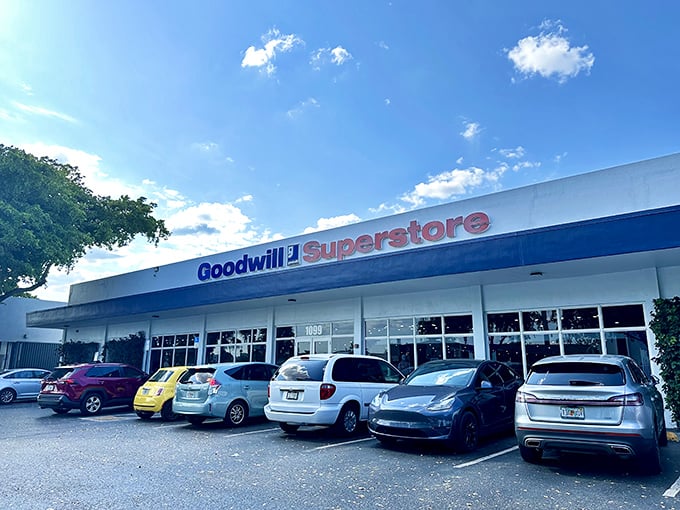 The blue and red Goodwill Superstore sign beckons like a retail lighthouse, promising treasures within that won't shipwreck your budget.