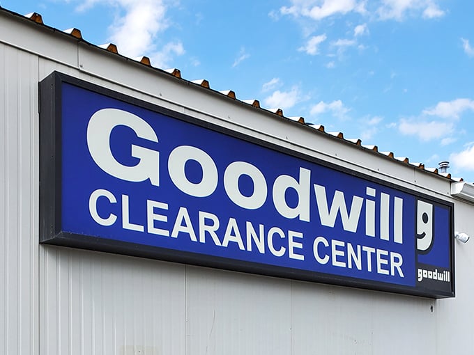 The iconic blue sign beckons treasure hunters like a retail lighthouse, promising adventures in secondhand shopping that would make Indiana Jones jealous.