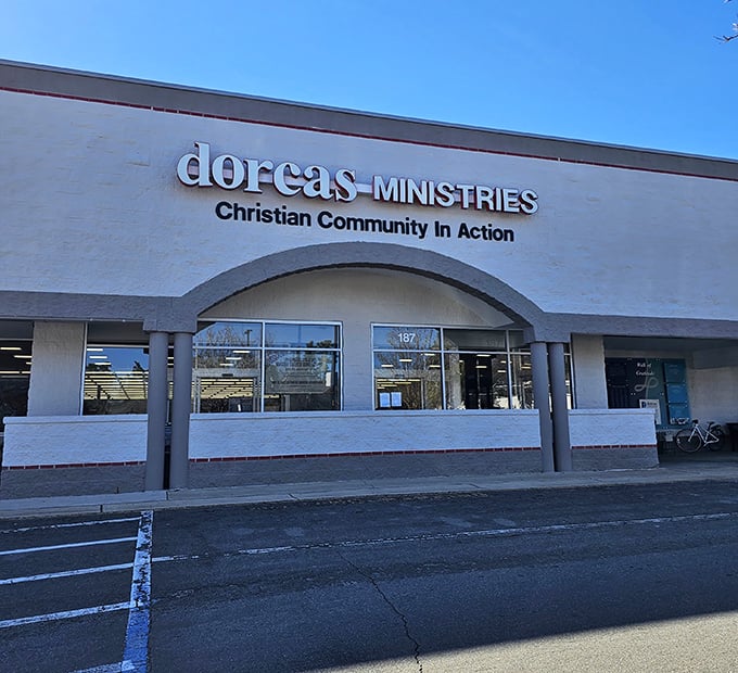 The unassuming exterior of Dorcas Ministries hides a treasure trove within. Like finding an extra onion ring in your fries – unexpected joy awaits!