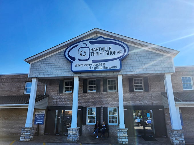 The stately facade of Hartville Thrift Shoppe promises treasure hunting adventures behind those columns, where every purchase truly is a gift to the world.