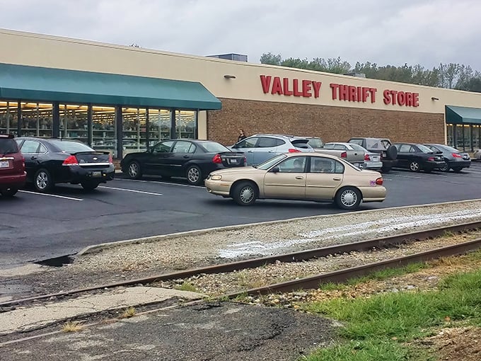 The iconic red lettering against beige brick announces your arrival at bargain paradise. Like a retail oasis in Kettering, Valley Thrift Store beckons with promises of treasures within.
