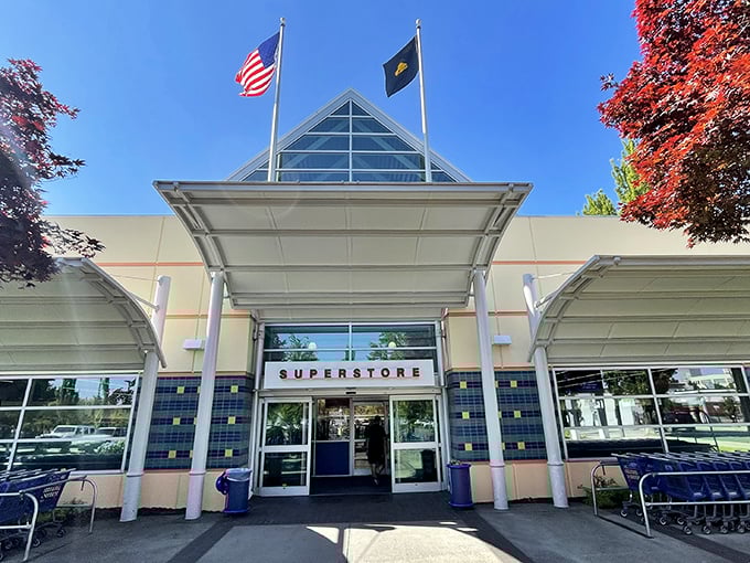 The iconic triangular entrance of Goodwill's SE 6th Avenue Superstore stands like a beacon for bargain hunters, promising treasures beneath those bright blue skies.