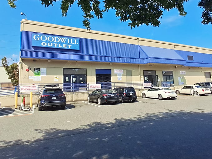 The blue-trimmed facade of Seattle Goodwill Outlet beckons bargain hunters like a siren call to sailors of savings.