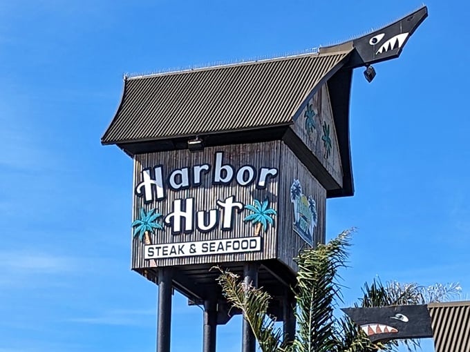 Harbor Hut stands proudly alongside its "Lil Hut" fish and chips takeout window—proof that sometimes the best seafood comes in humble packages with spectacular views.