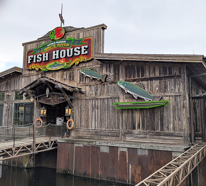 The weathered wooden exterior isn't just rustic charm—it's a promise of authenticity. This floating fish sanctuary beckons hungry travelers with its unmistakable Ozark character.