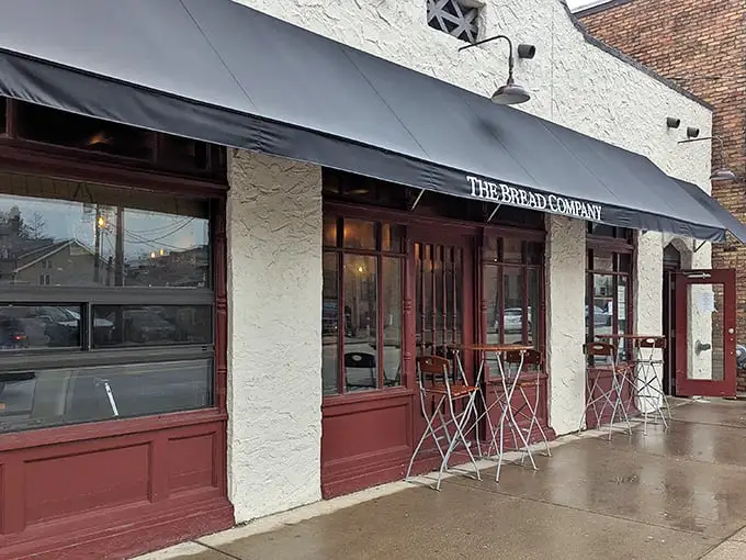 The charming façade of The Bread Company beckons like a European postcard come to life in the heart of Urbana. Those red-trimmed windows aren't just for show—they're portals to flavor country.