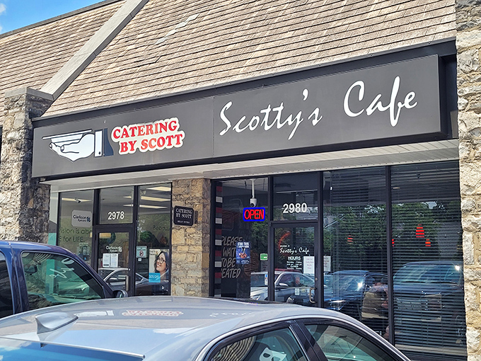 Scotty's Café nestles into this stone-faced strip mall like a culinary secret waiting to be discovered. The unassuming exterior belies the comfort food treasures within.