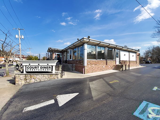 The classic stone and brick exterior of Court Diner stands like a beacon of breakfast hope in Media, Pennsylvania. American flag included, no extra charge.