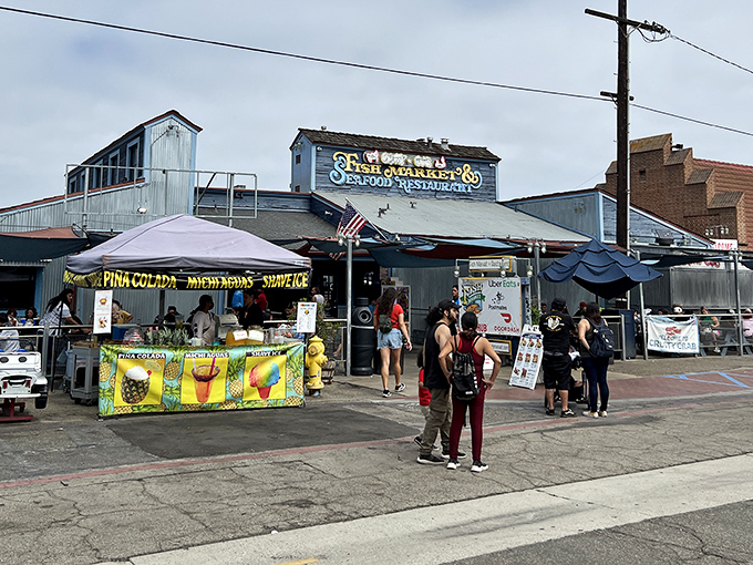 The iconic blue and white sign beckons seafood lovers like a maritime lighthouse, promising treasures from the deep that would make Poseidon himself line up for a tray.