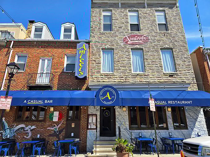 Amicci's iconic blue awning and vertical sign stand out in Baltimore's Little Italy like a beacon for hungry souls seeking Italian comfort food paradise.