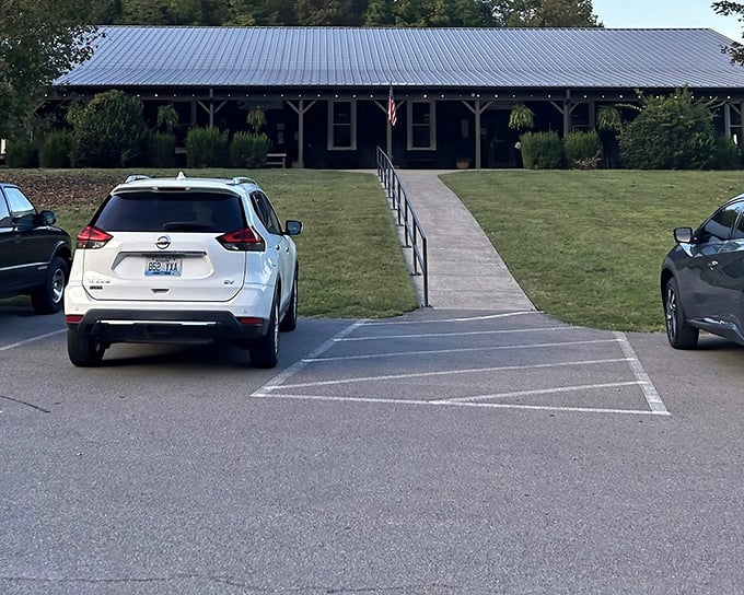 The unassuming exterior of Catfish House stands like a culinary secret waiting to be discovered, with its metal roof and welcoming porch promising authentic Tennessee flavors inside.