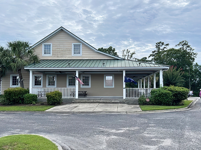 Morning light bathes the homey facade, where American and South Carolina flags flutter in the breeze—a patriotic prelude to the comfort food paradise within.