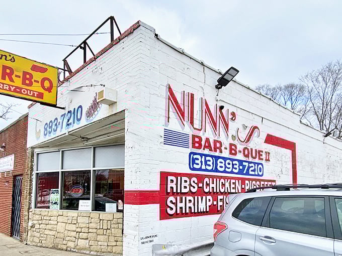 The unassuming white brick exterior of Nunn's Bar-B-Que II stands like a culinary lighthouse on Detroit's west side, promising smoky treasures within.