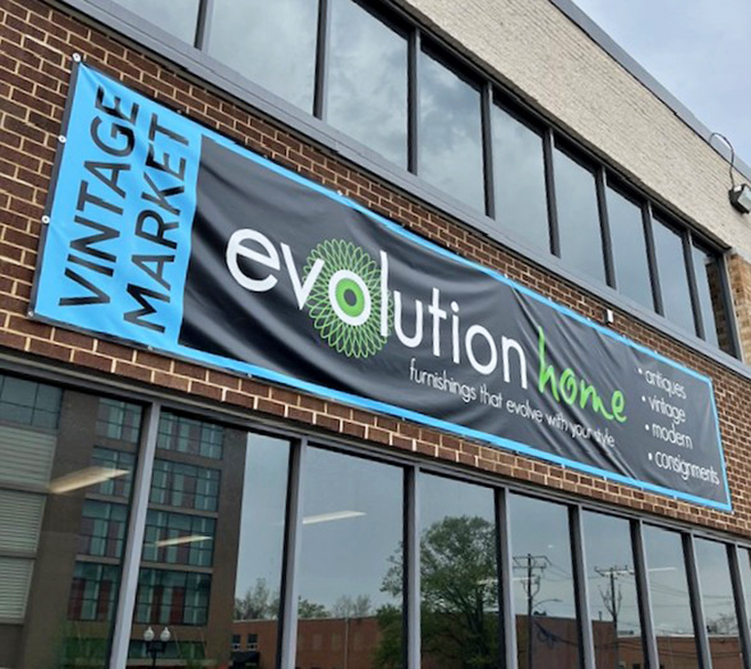 "Evolution Home's bright blue banner promises 'furnishings that evolve with your style' – a tagline that perfectly captures this treasure hunter's paradise in Alexandria."