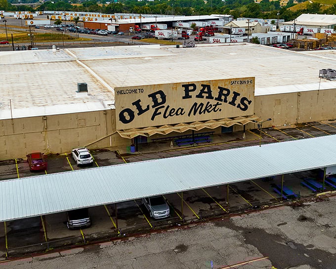 The iconic Old Paris Flea Market sign stands proudly against the Oklahoma sky, a beacon for treasure hunters and nostalgia seekers alike.