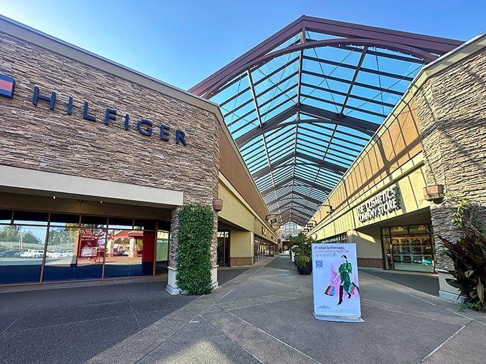 Tommy Hilfiger welcomes shoppers under Woodburn's signature skylit walkways, where retail therapy meets architectural elegance.
