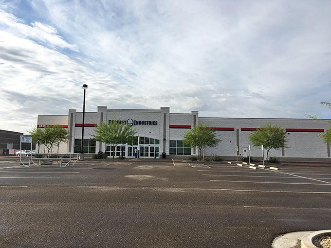 The unassuming exterior of Deseret Industries in Glendale hides a treasure trove within—like finding the Narnia wardrobe in the Arizona desert.