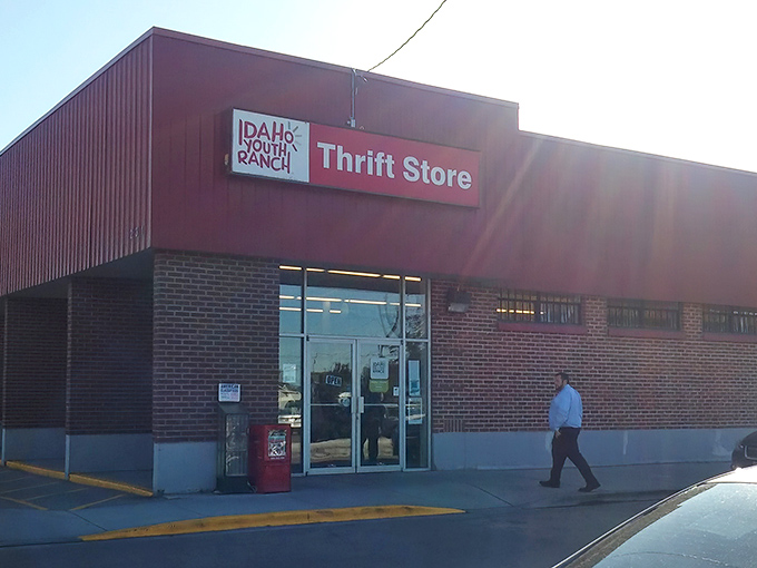 The unassuming exterior of Idaho Youth Ranch Thrift Store – where treasure hunters find their El Dorado behind a humble brick façade.
