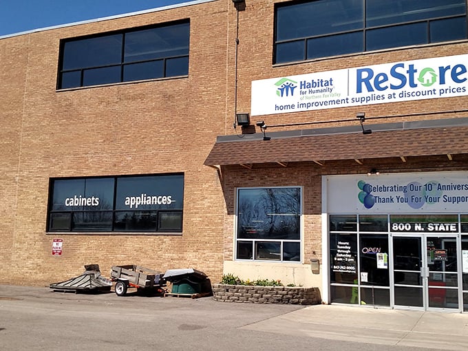 The ReStore's brick façade stands like a fortress of finds, guarding everything from vintage doorknobs to nearly-new refrigerators inside.