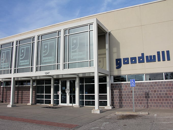 The modern exterior of Goodwill in Derby beckons with its clean lines and signature blue logo—a treasure chest disguised as a retail store.