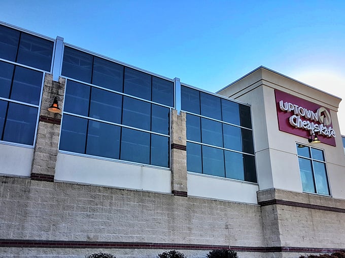 The iconic burgundy sign beckons like a lighthouse for fashion treasure hunters. Uptown Cheapskate's modern exterior promises this isn't your grandmother's thrift store.