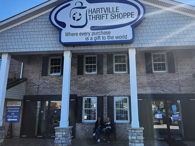 The welcoming facade of Hartville Thrift Shoppe promises treasure hunting adventures within. That sign isn't kidding—every purchase really does give twice.
