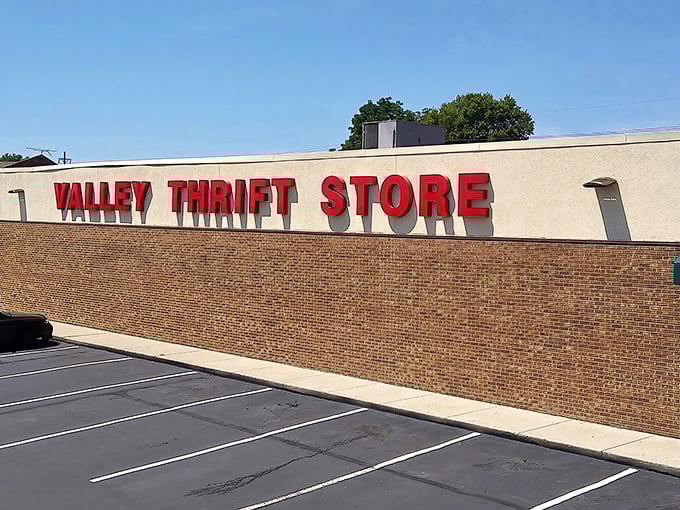 The iconic red lettering against beige brick announces your arrival at bargain paradise. Like a retail oasis in Kettering, Valley Thrift Store beckons with promises of treasures within.