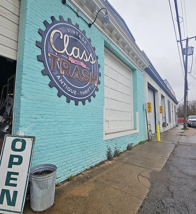 The turquoise facade of Class and Trash beckons like a siren song to treasure hunters. That vintage gear logo practically screams "interesting finds inside!"