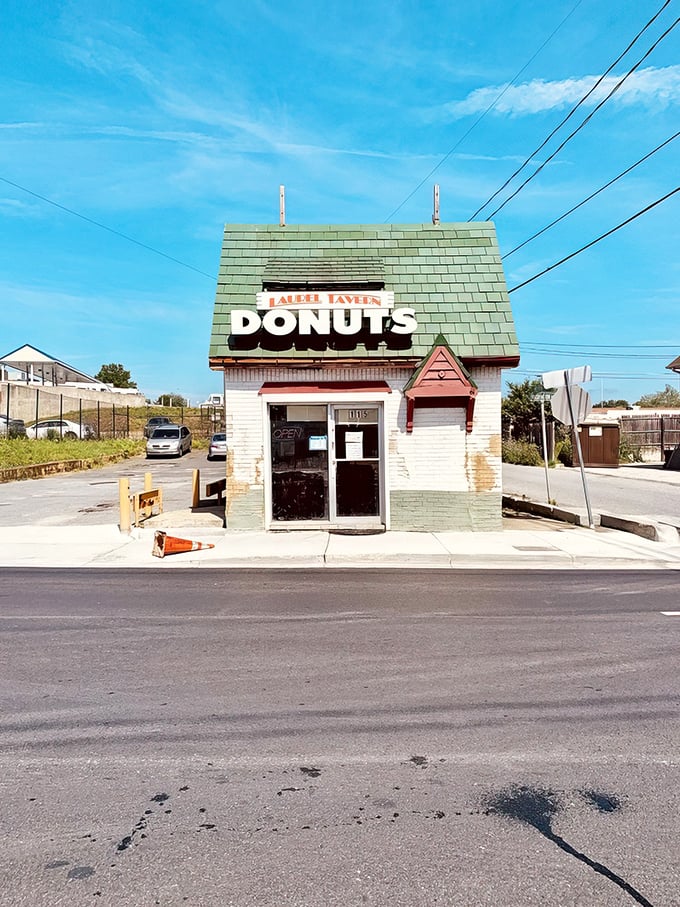 Laurel Tavern Donuts doesn't need fancy architecture—the iconic green roof and bold signage say everything you need to know.