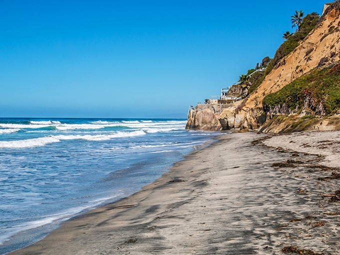 The California dream, distilled into one perfect view: golden cliffs, azure waters, and a stretch of sand that whispers "slow down, you've arrived."
