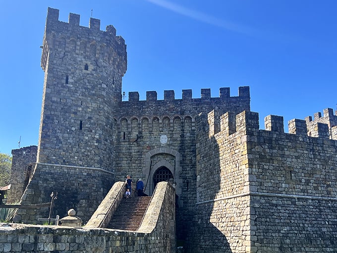 The imposing entrance to Castello di Amorosa stands guard like a medieval bouncer who takes his job way too seriously.