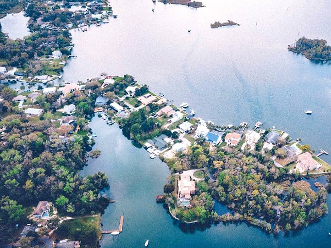 From above, the waterfront neighborhood showcases a serene paradise, with every home boasting stunning views and direct access to the water.
